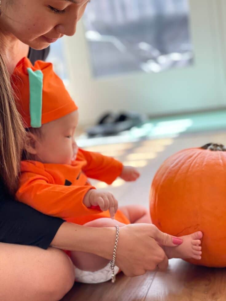 This Baby Pumpkin Handprint Art Celebrates Baby's First Halloween!