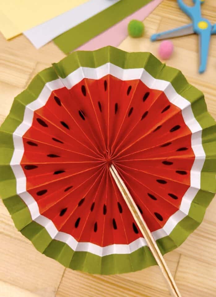 This DIY Watermelon Paper Fan is the Cutest Summer Craft